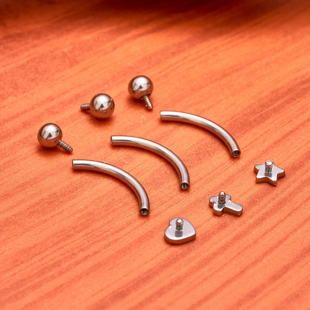 Star curved barbell small and cute with a star and a ball titanium pie ...