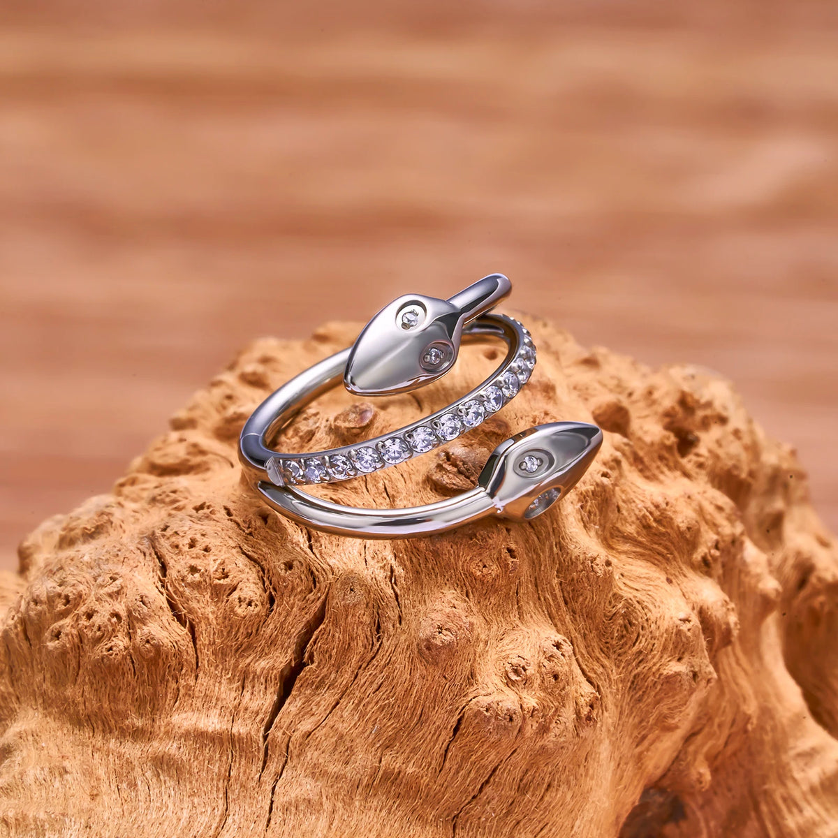 Snake nose hoop with a two-headed snake and clear cz snake bite hoop p ...