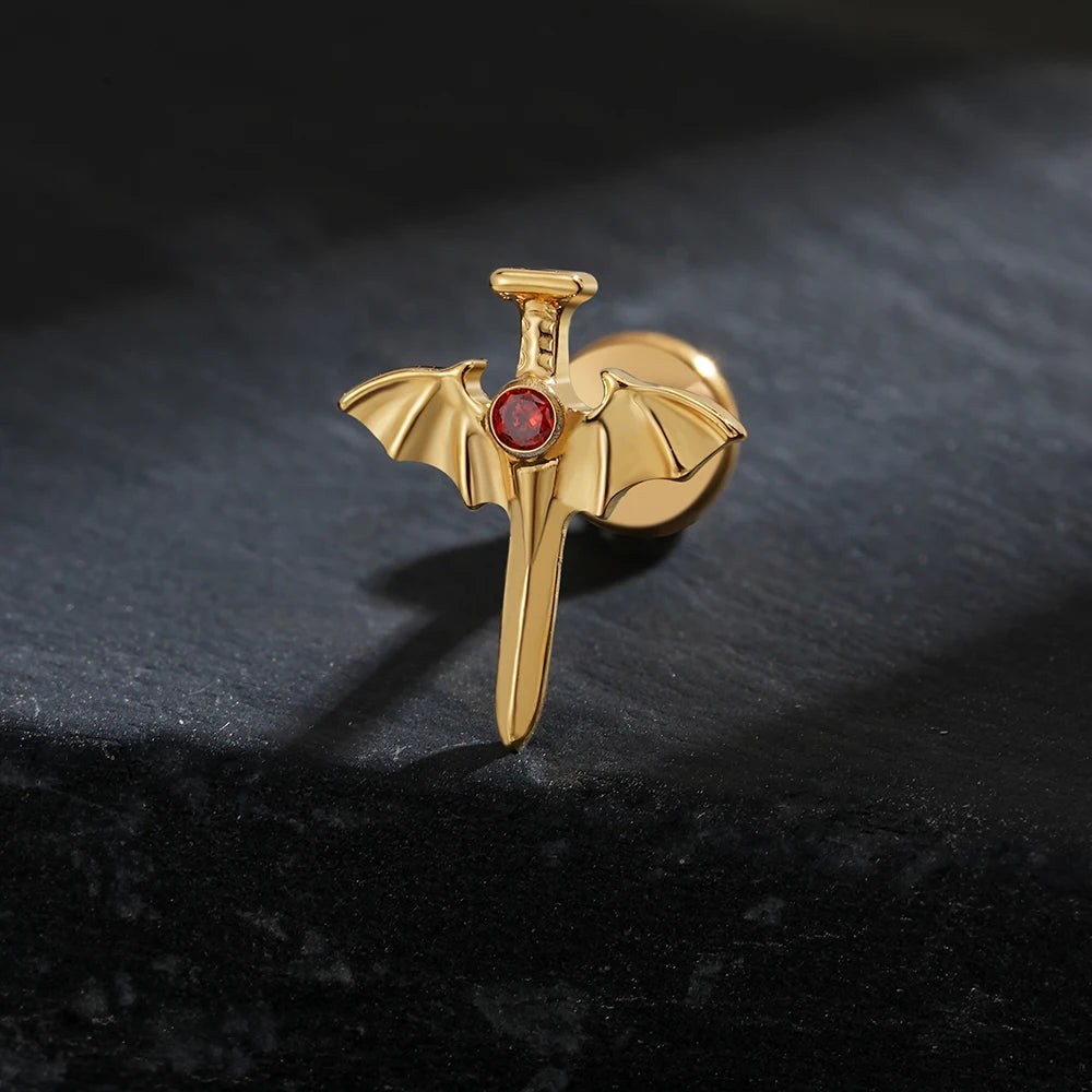 Sword ear piercing with bat wings and a red stone made of titanium hal ...
