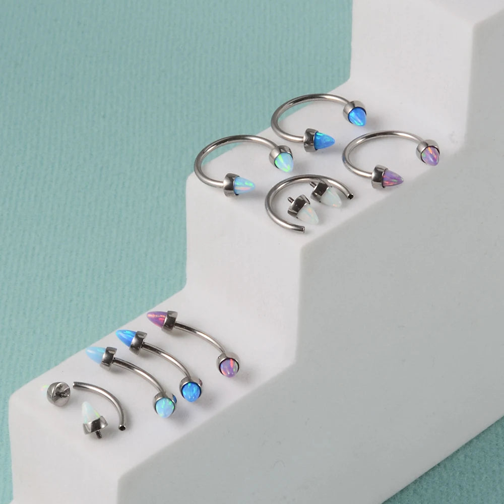 Spike eyebrow piercing with opal white blue purple titanium curved bar ...